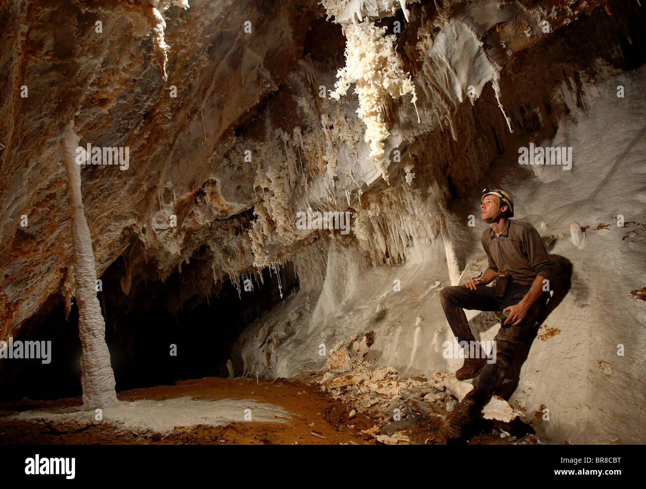 A British cave explorer casually admires the highly decorative ...