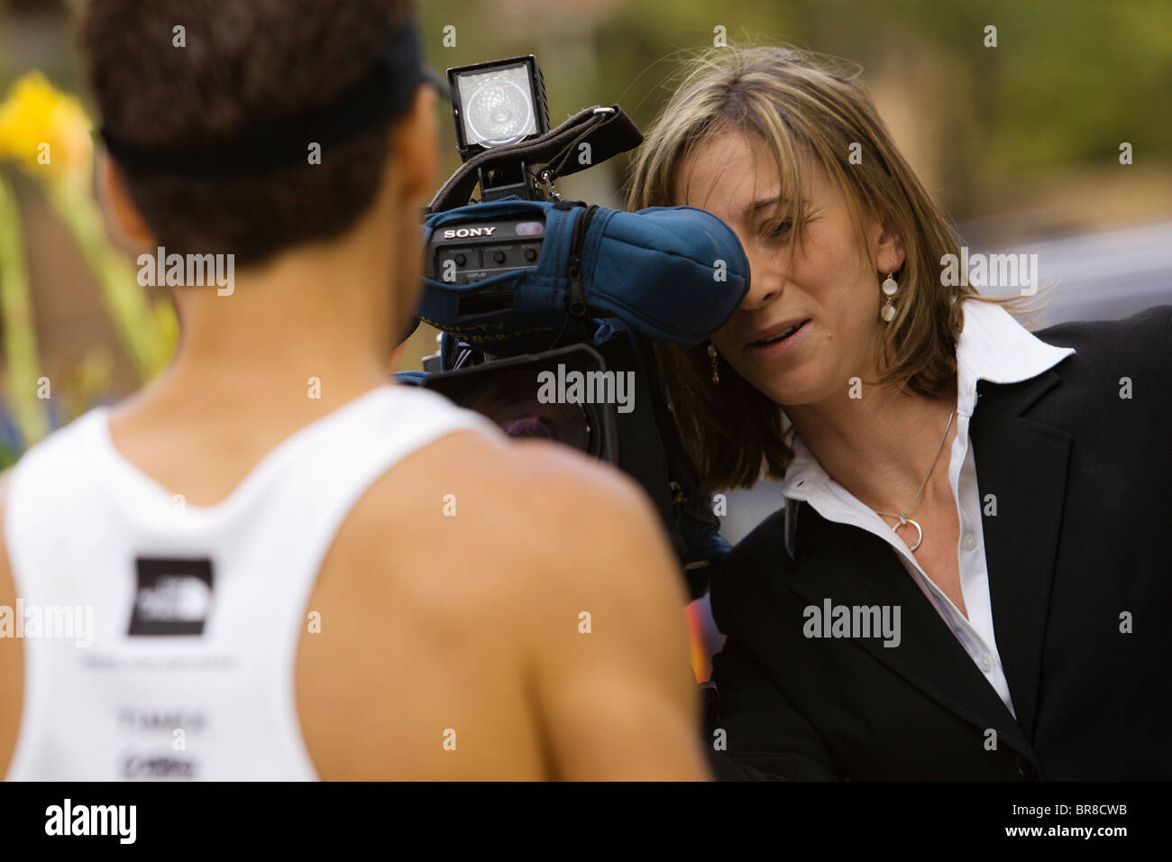 Runner being interviewed after a marathon in Des Moines Iowa Stock ...