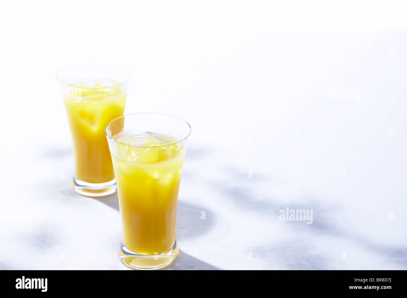 Two glasses of orange juice Stock Photo - Alamy