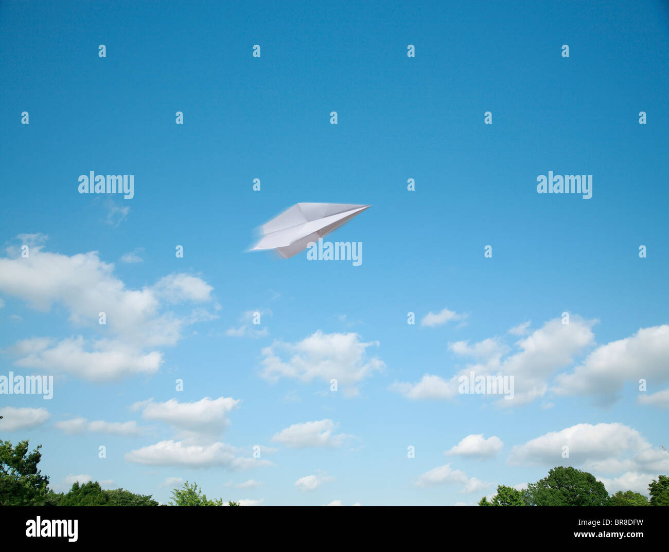 Paper airplane flying Stock Photo - Alamy
