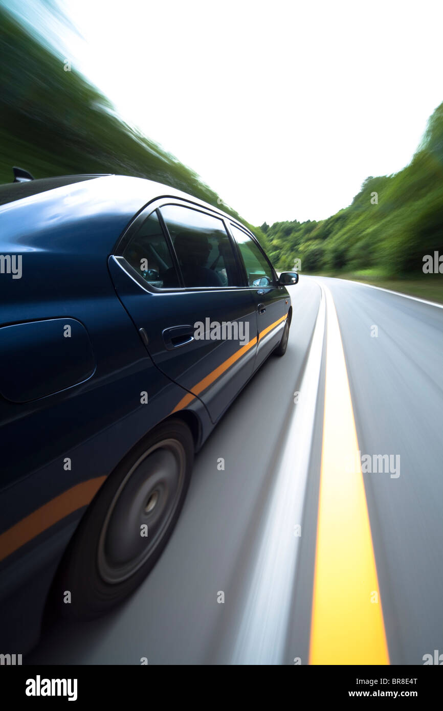 Car driving on road Stock Photo - Alamy
