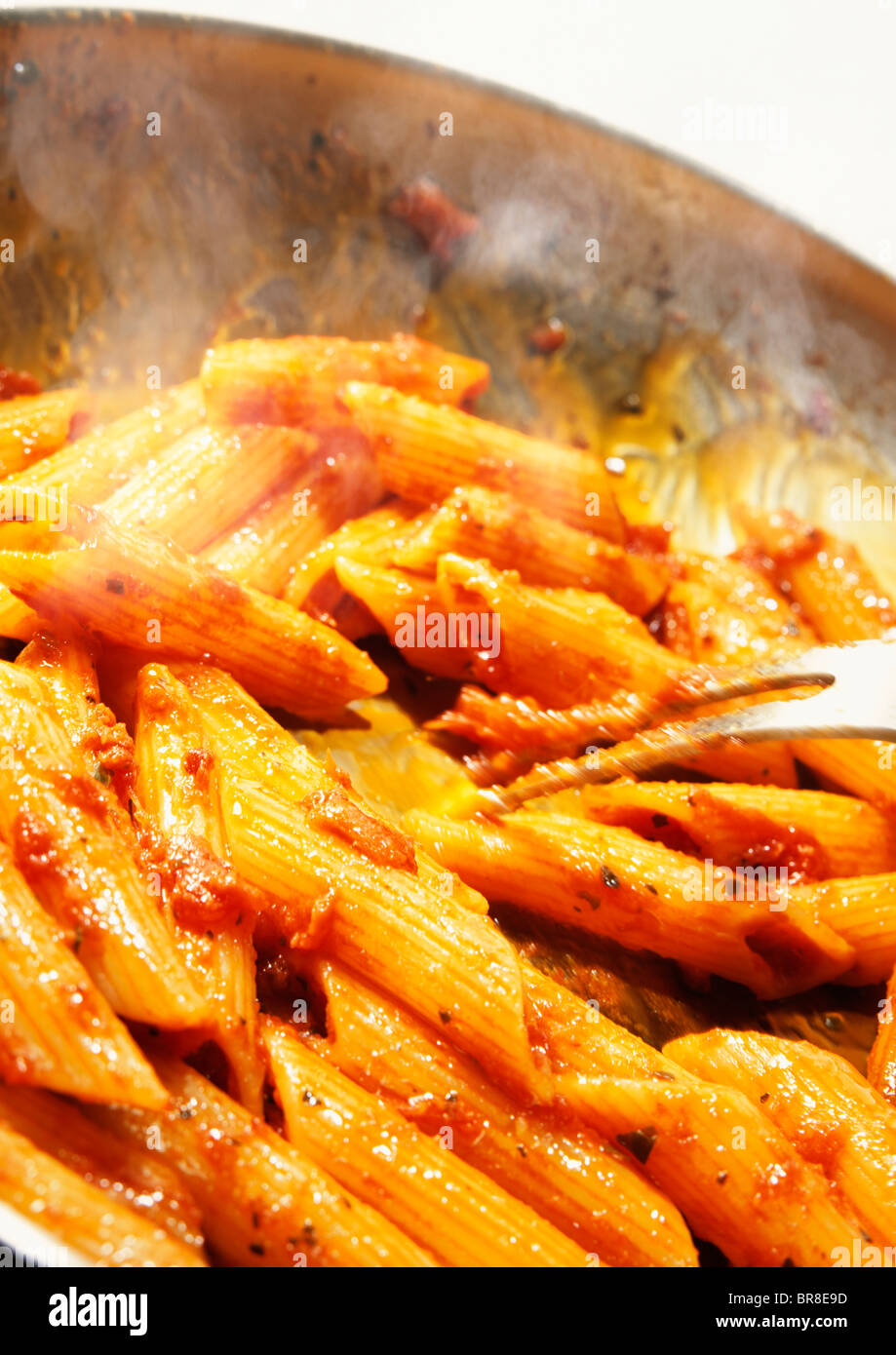 Cooking penne pasta Stock Photo - Alamy