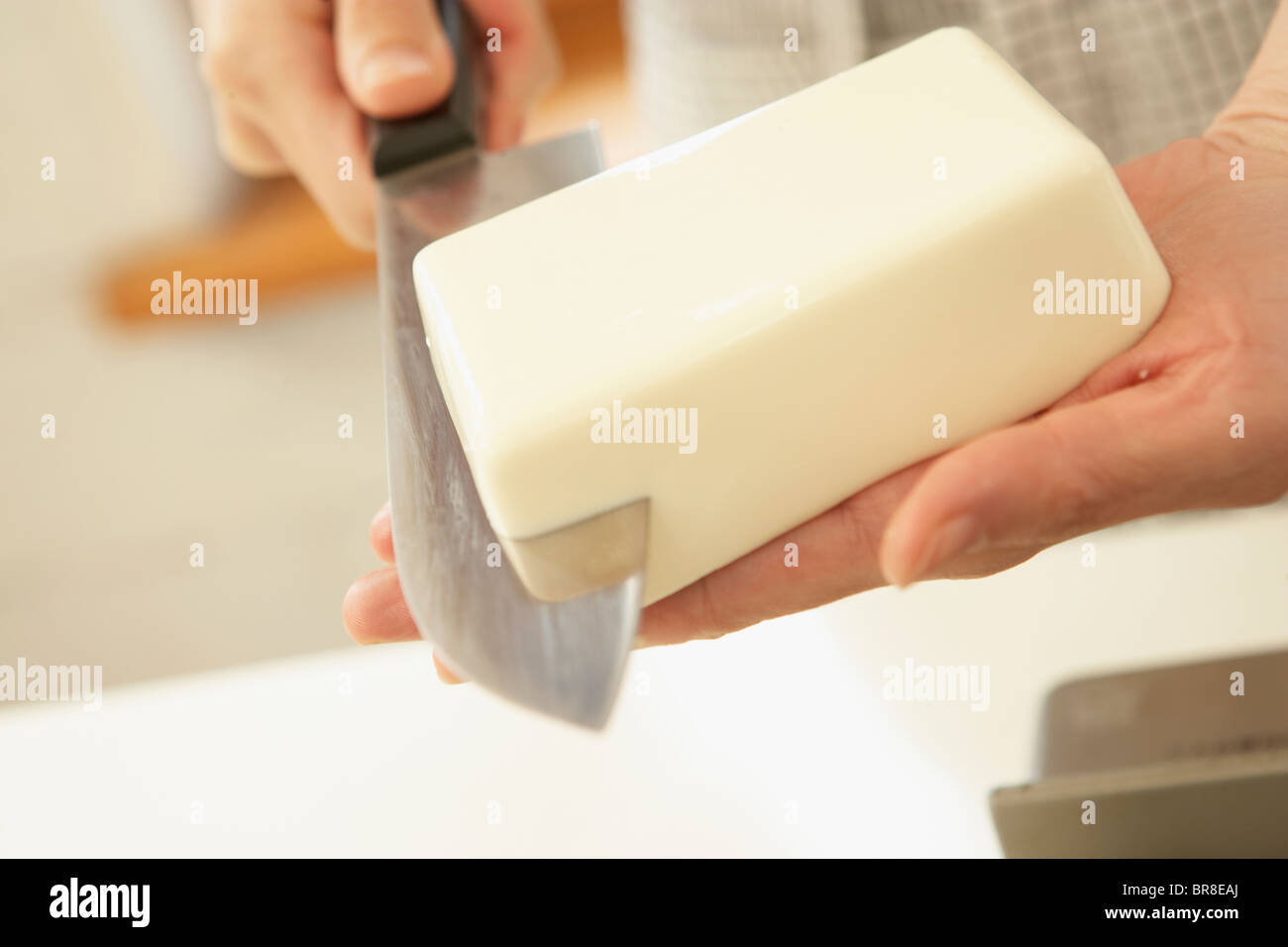 Woman cutting Tofu on hand, close up Stock Photo - Alamy