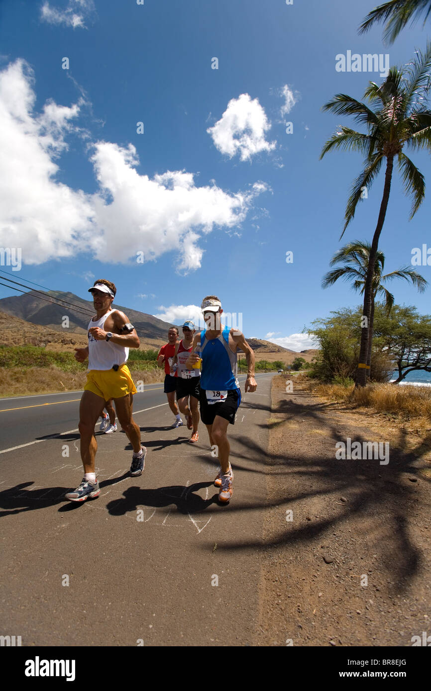 People running a marathon along the coast of Maui Hawaii Stock Photo ...