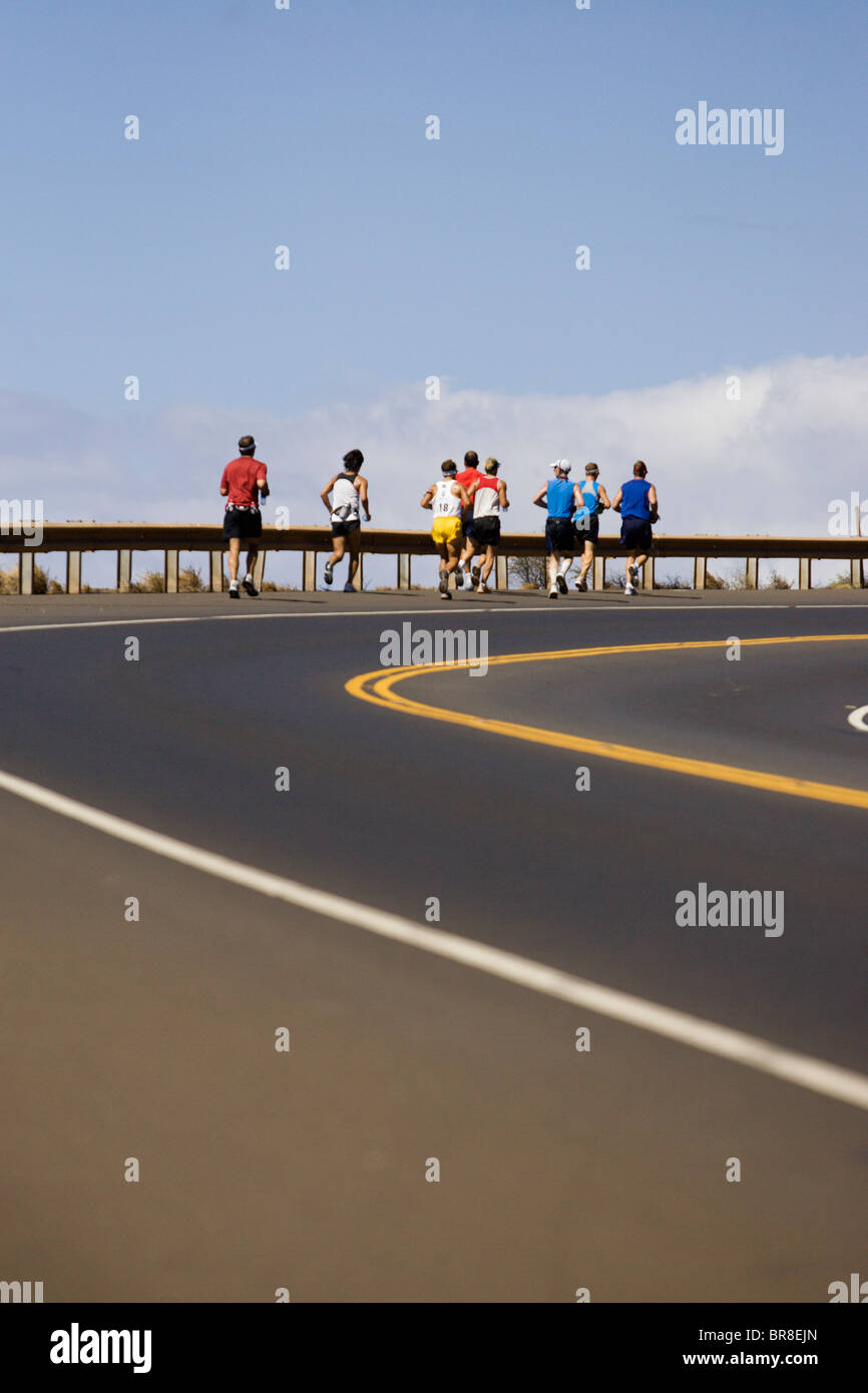 People running a marathon on the side of a highway in Maui Hawaii Stock ...