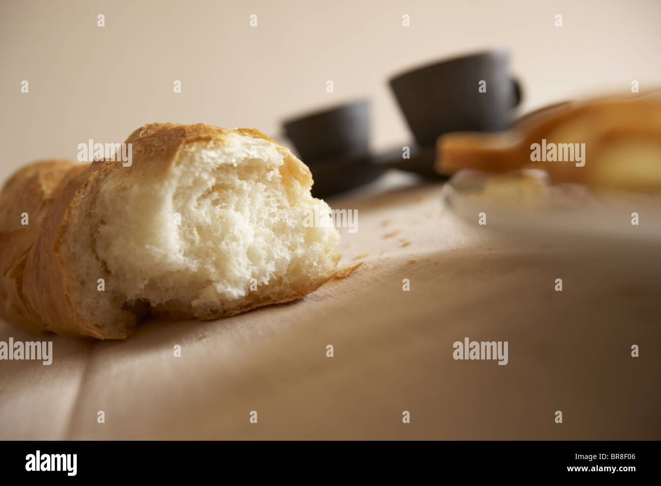 Loaf of bread and coffee cups, close up Stock Photo - Alamy