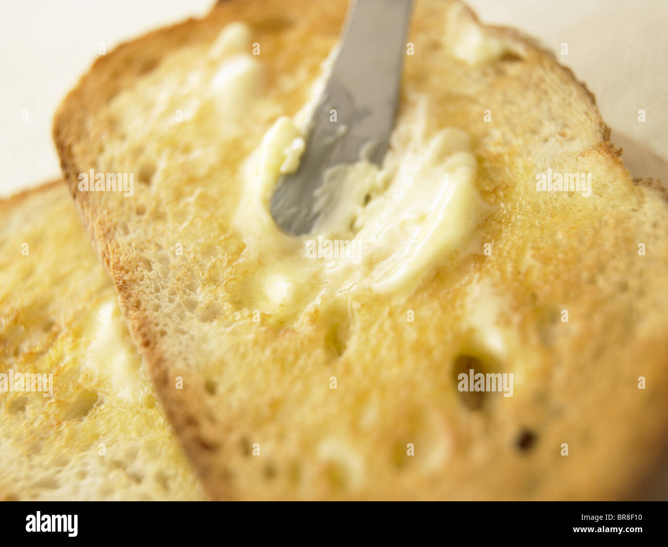 Slices of toast with butter, close up Stock Photo - Alamy