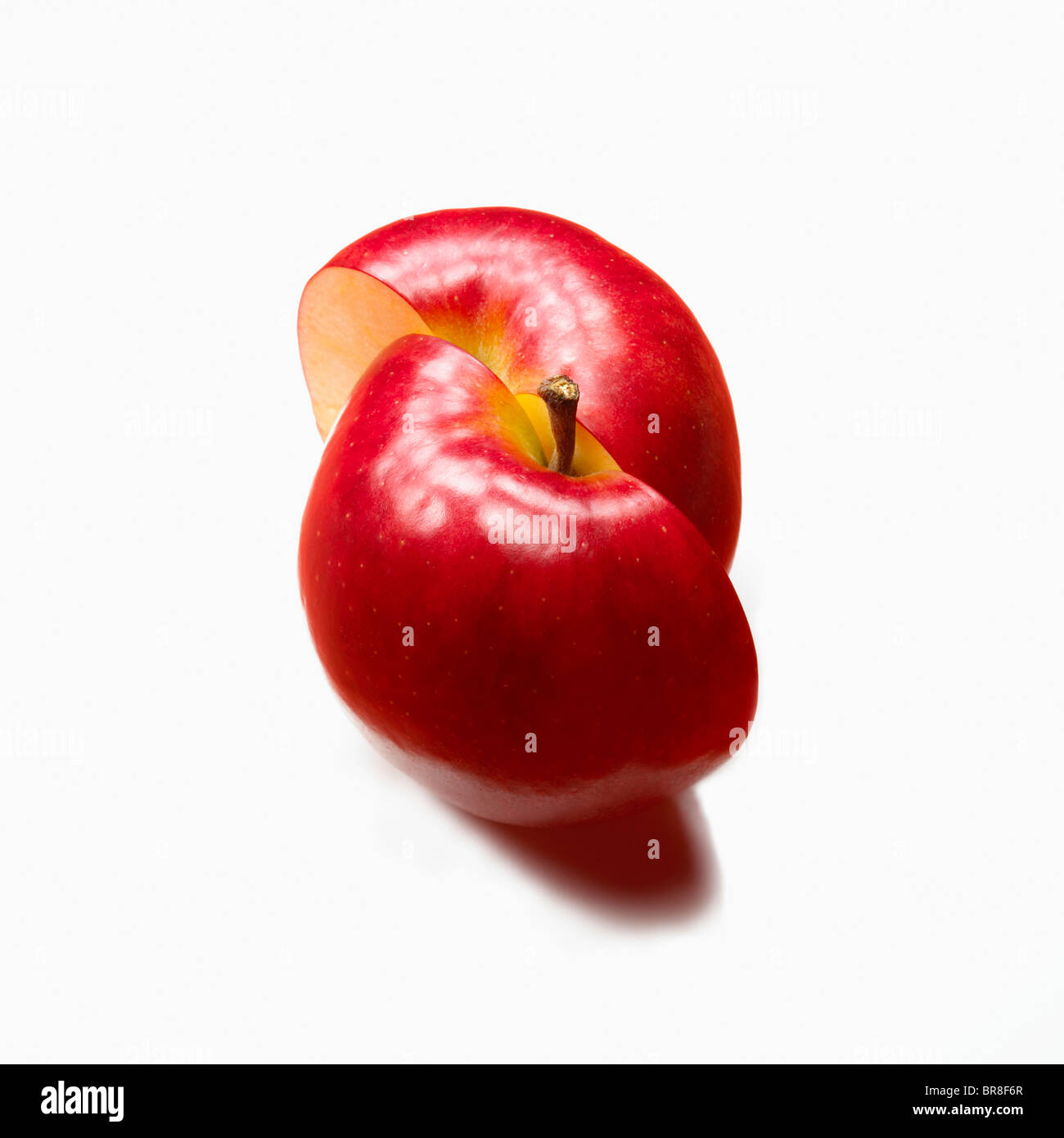 Apple sliced in half, white background Stock Photo - Alamy