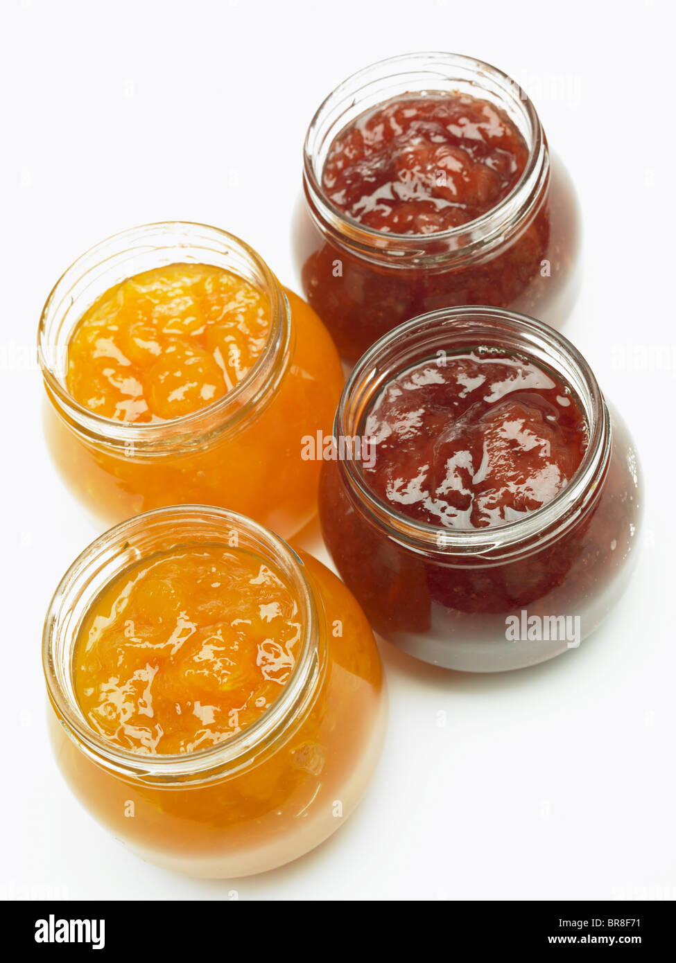 Four jars of jam, close up, white background Stock Photo - Alamy