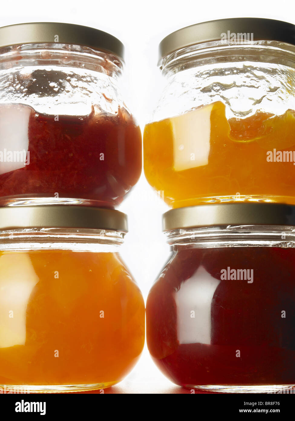 Four jars of jam, close up, white background Stock Photo - Alamy