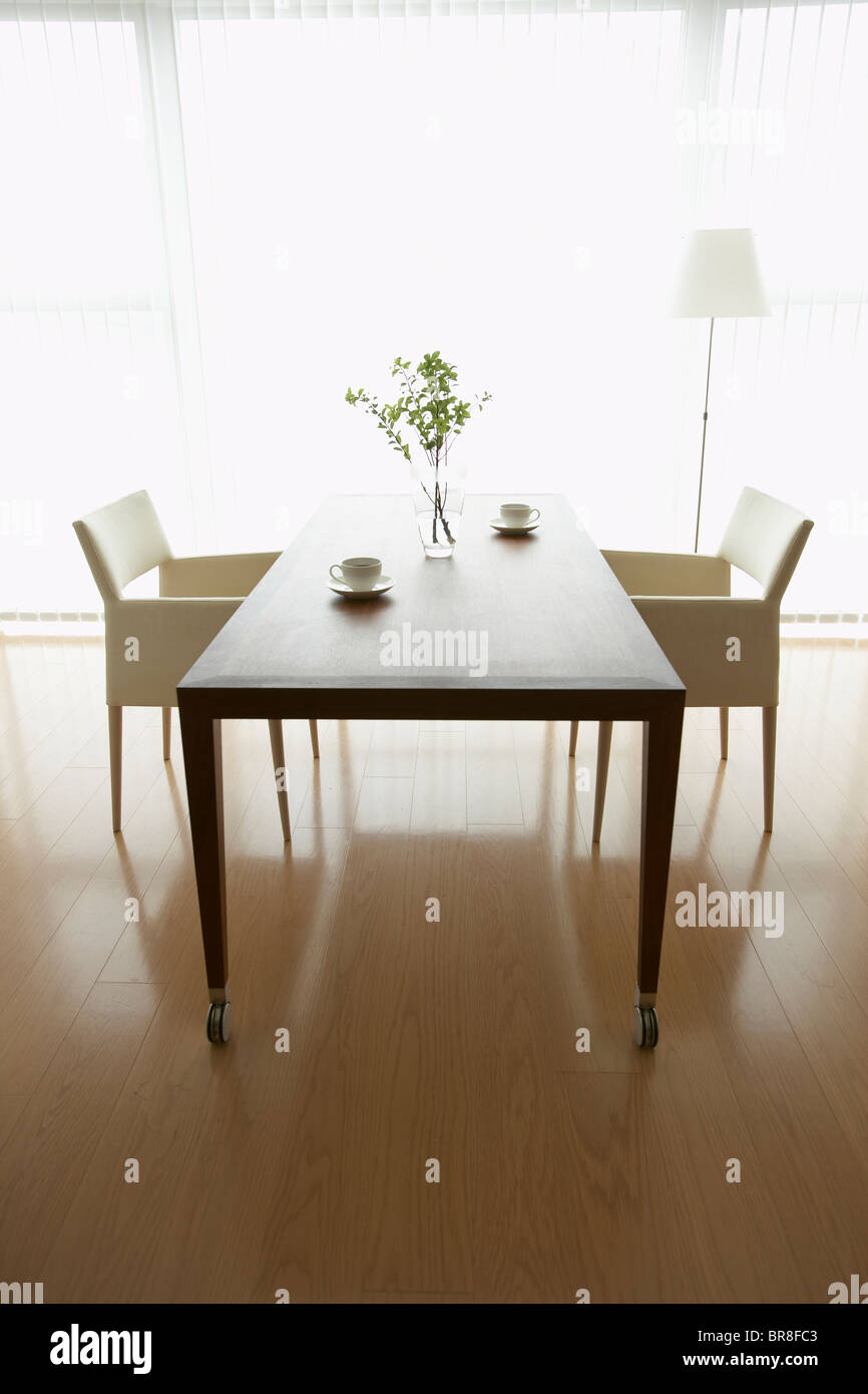 Coffee cups on dining table Stock Photo - Alamy