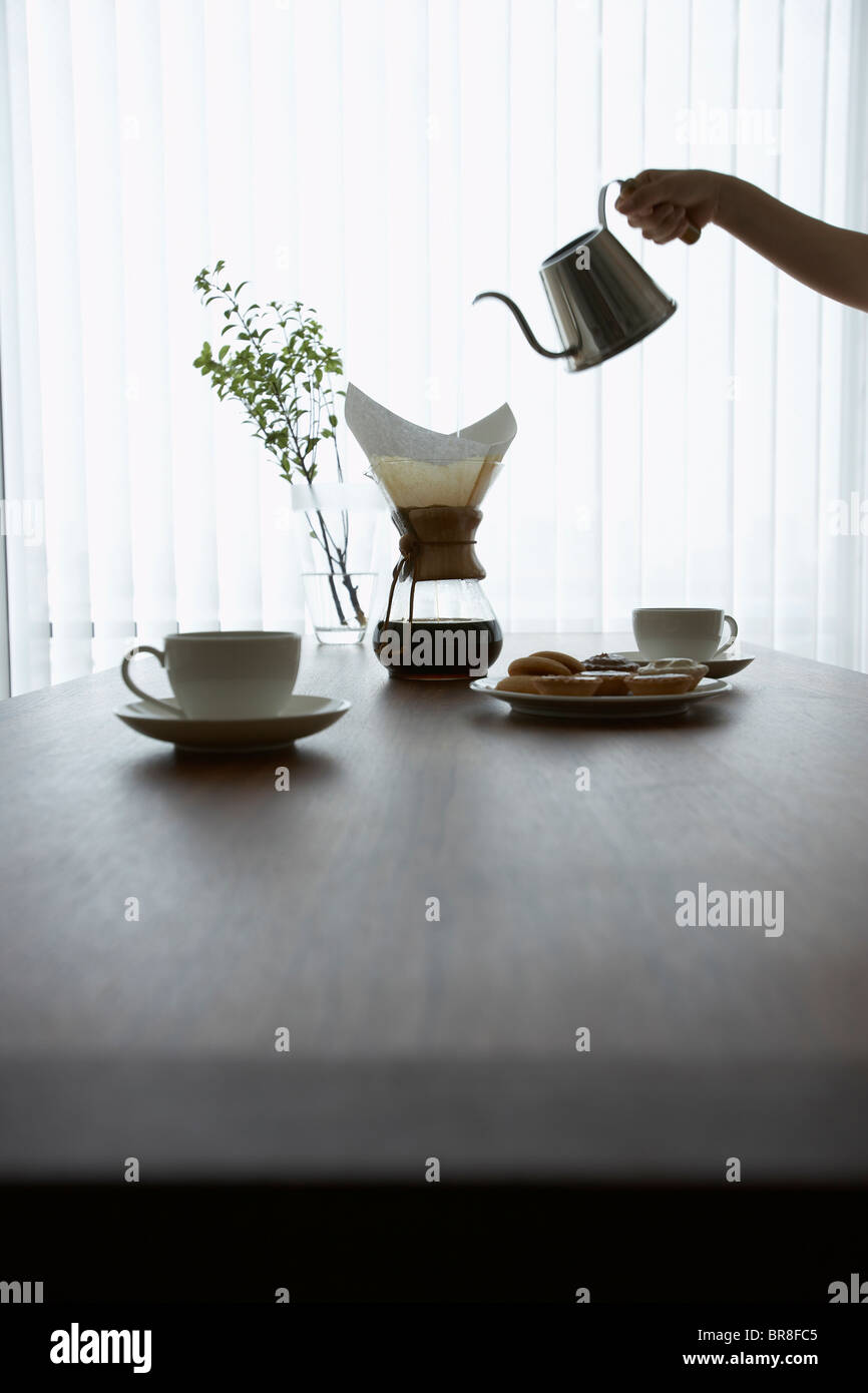 Woman making coffee Stock Photo - Alamy