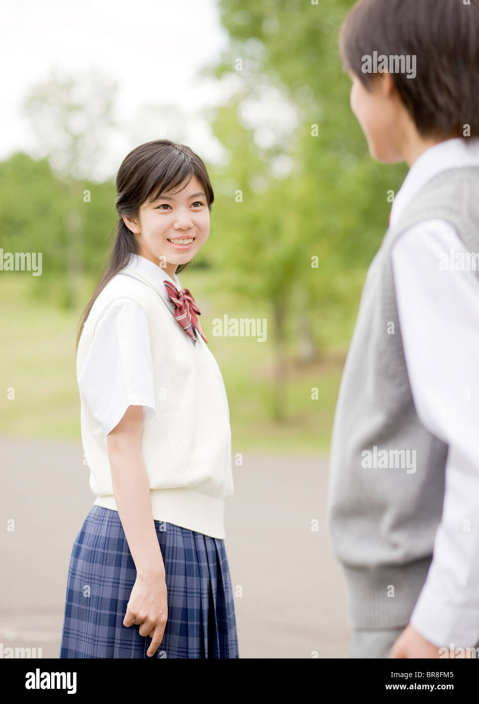 Junior high school students talking Stock Photo - Alamy