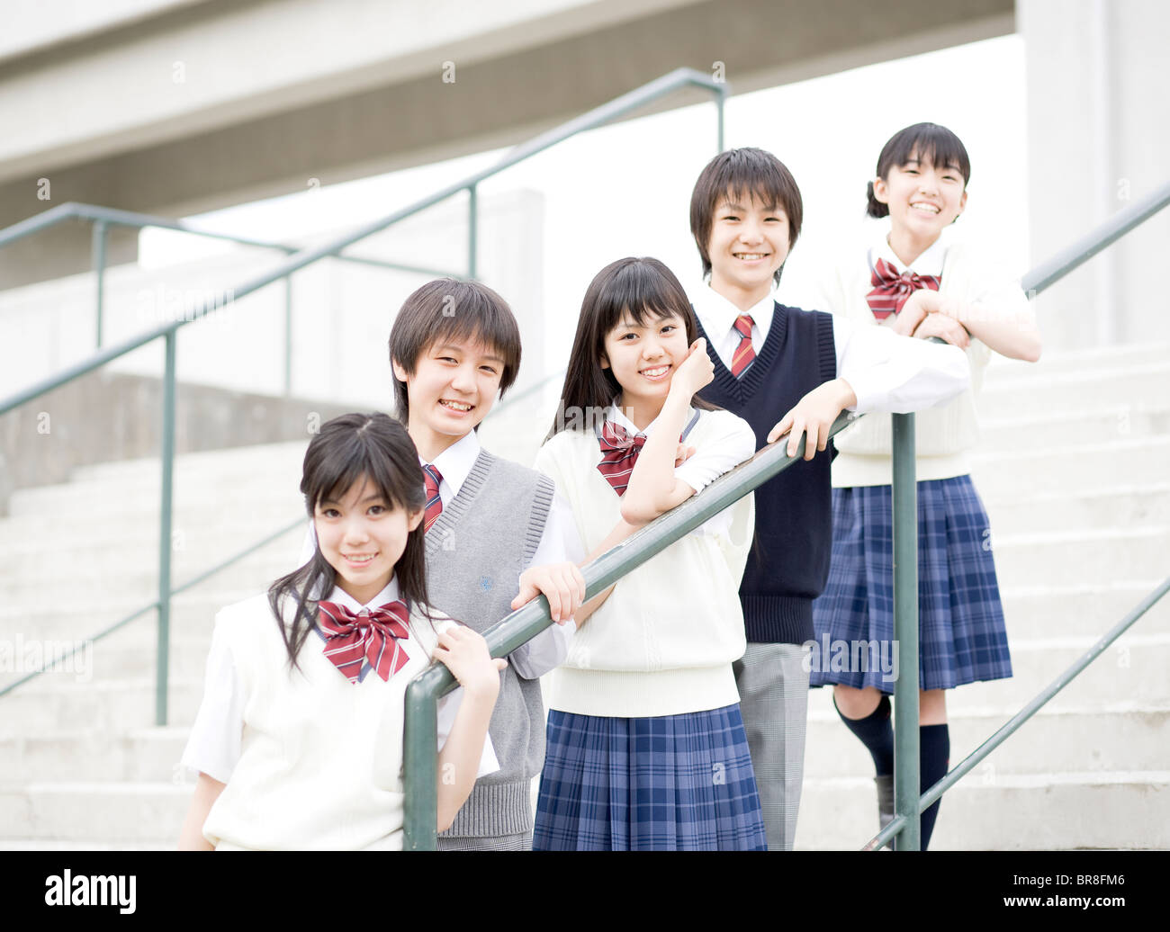 Junior high school students on steps Stock Photo - Alamy