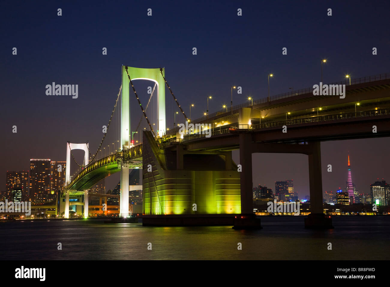 Illuminated Rainbow Bridge at night Stock Photo - Alamy