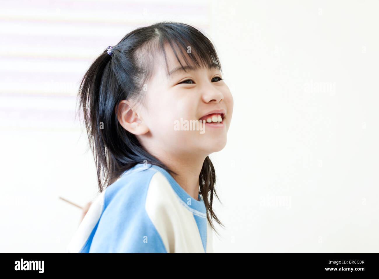 Girl at cram school smiling Stock Photo - Alamy