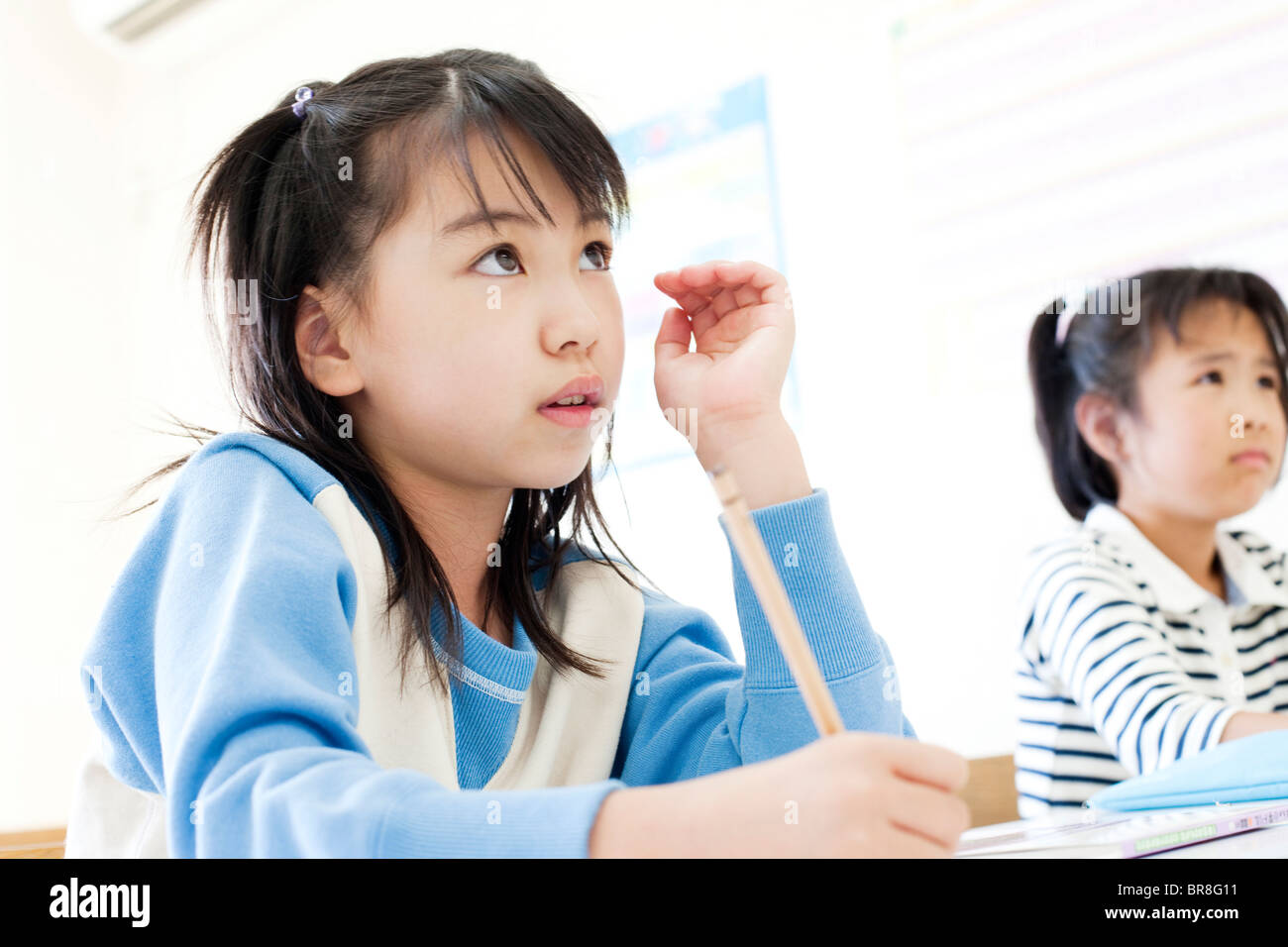 Girl studying at cram school Stock Photo - Alamy
