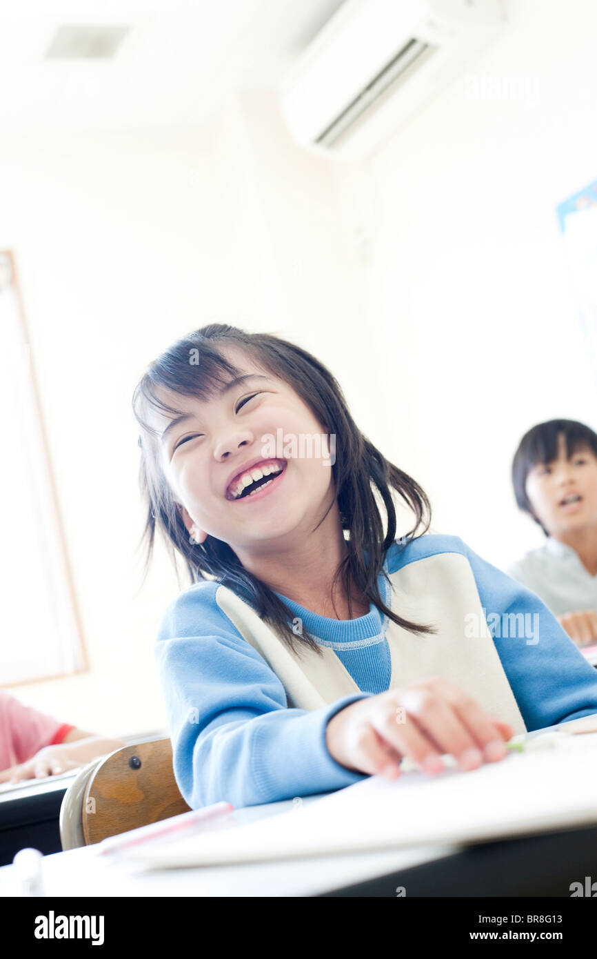 Girl at cram school smiling Stock Photo - Alamy