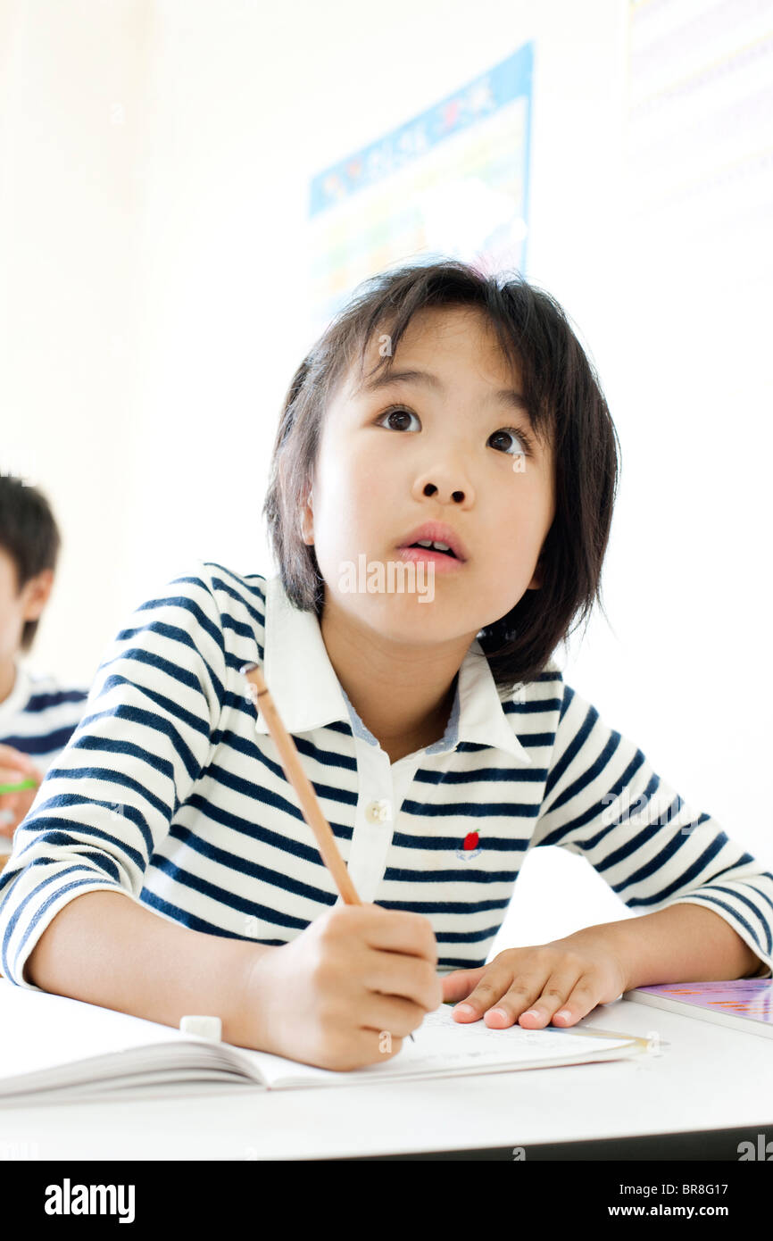 Girl at cram school smiling Stock Photo - Alamy