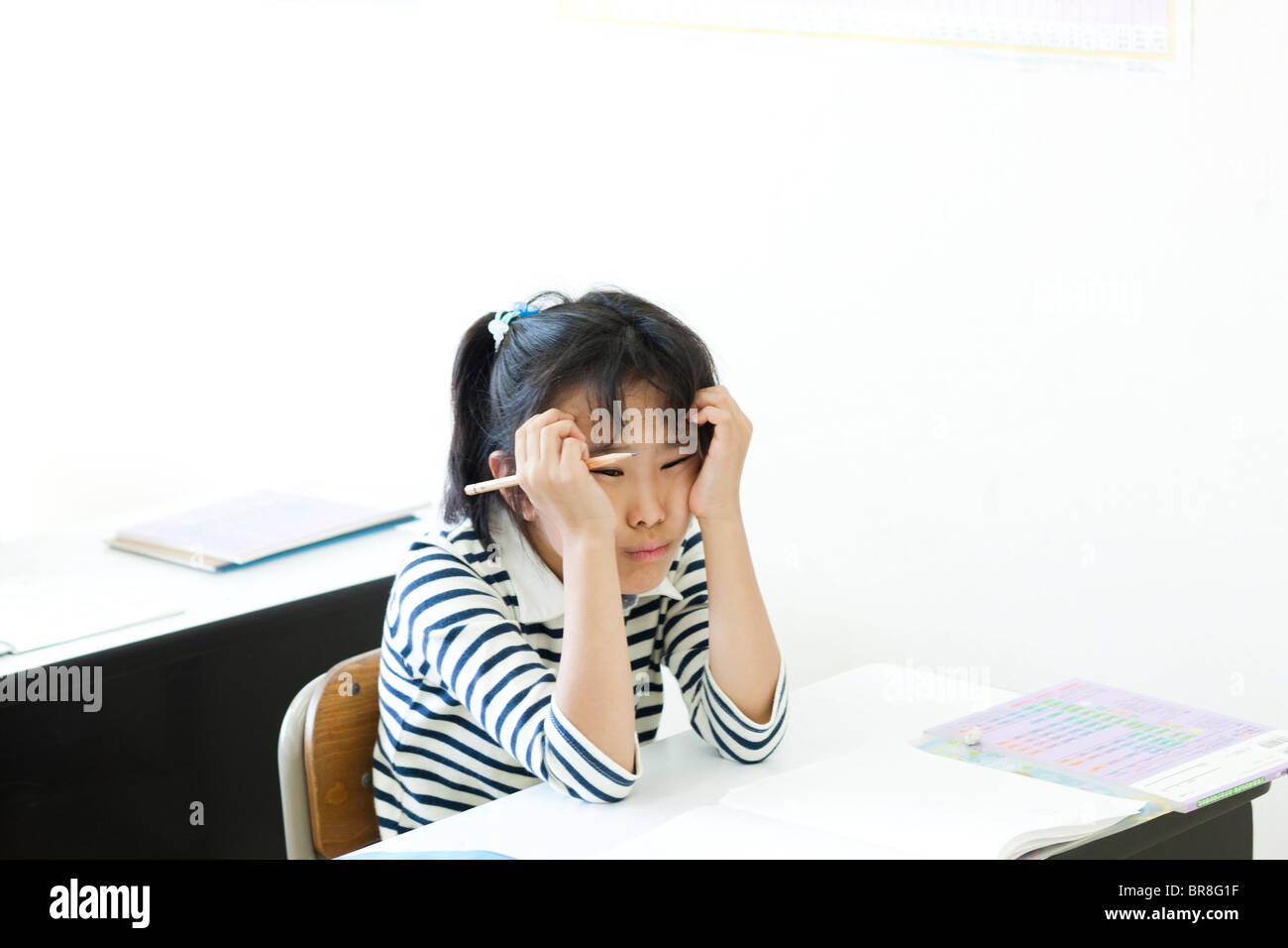 Girl frustrated at cram school Stock Photo - Alamy