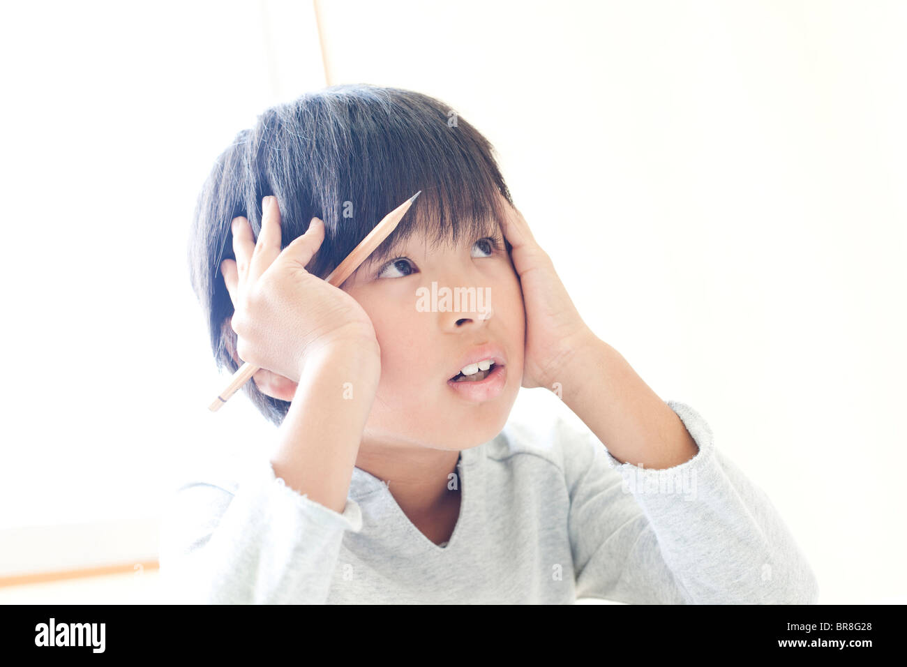 Boy frustrated at cram school Stock Photo - Alamy
