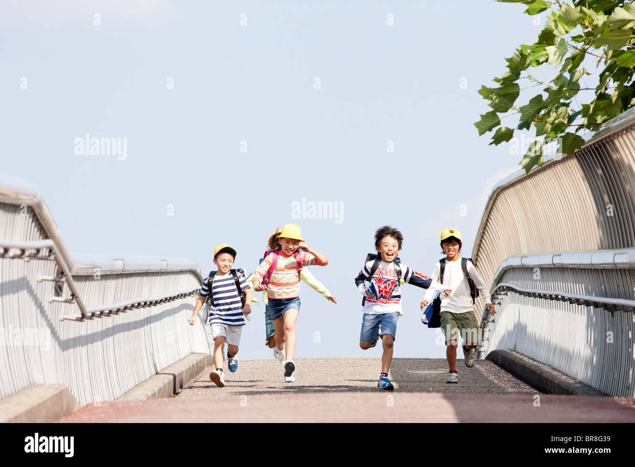 Elementary school students running to school Stock Photo - Alamy