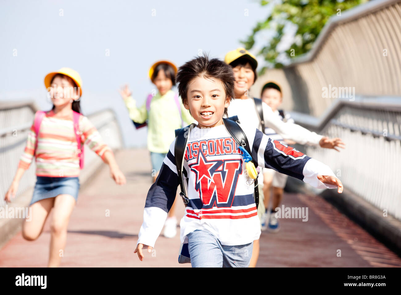 Elementary school students running to school Stock Photo - Alamy