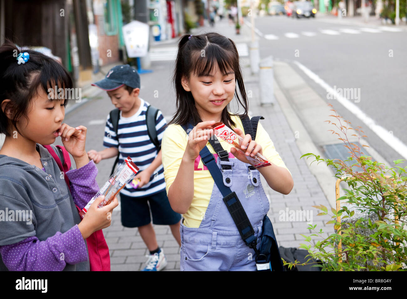 Children eating candies Stock Photo - Alamy