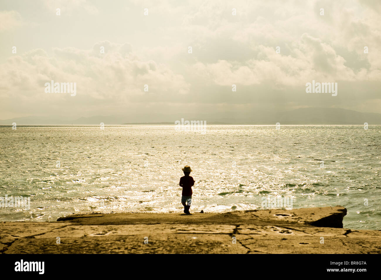 Boy standing silhouette hi-res stock photography and images - Alamy