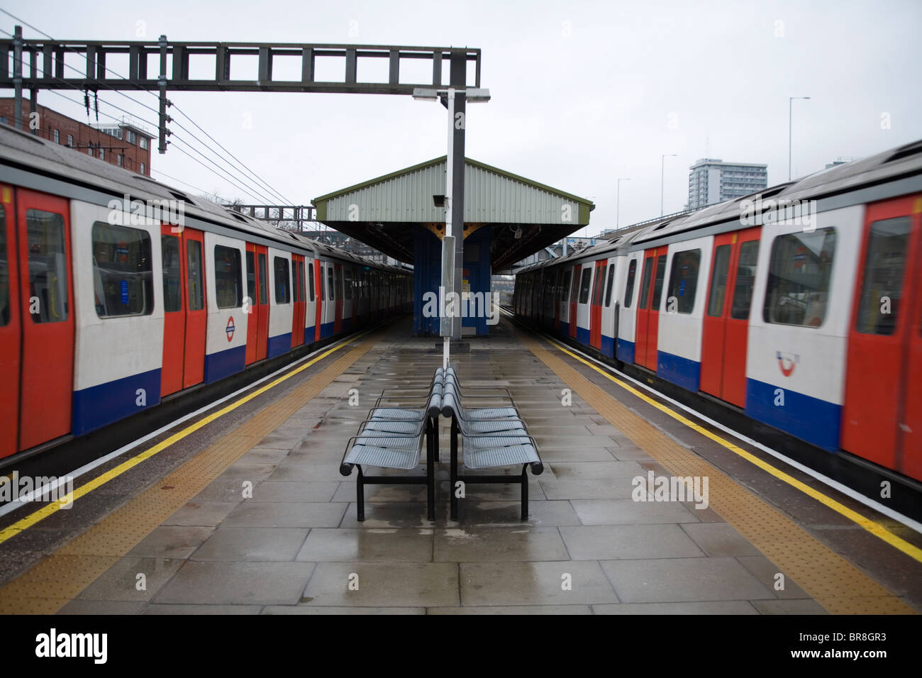 Two tube trains on each side of platform at Westbourne Park Station ...