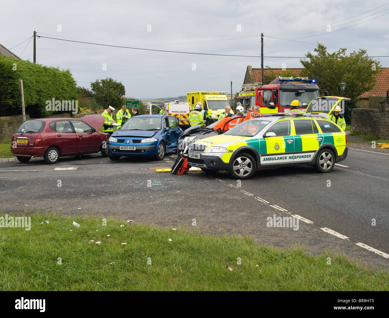 Emergency services work to rescue people from a multiple car crash ...