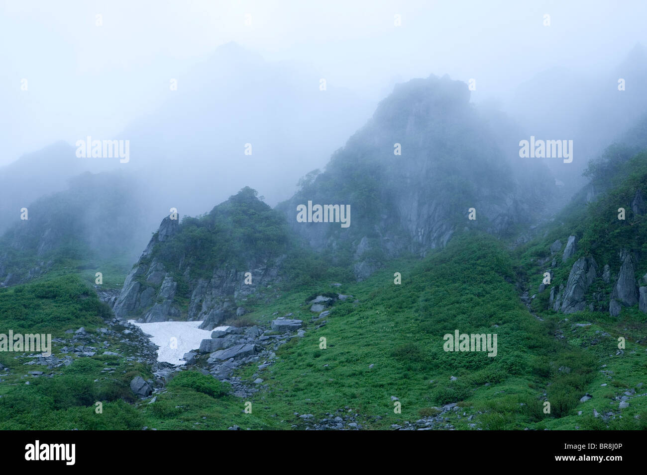 Mountains in rain Stock Photo - Alamy