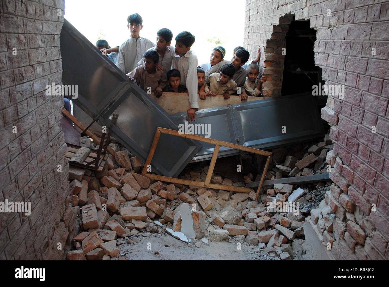 Children look damaged classrooms, which were destroyed in bomb ...