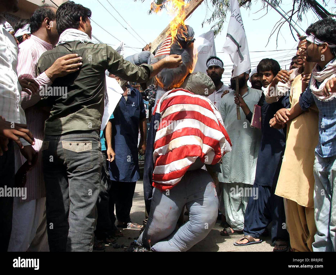 Residents of Hirabad burn US flag and effigy as they are protesting ...