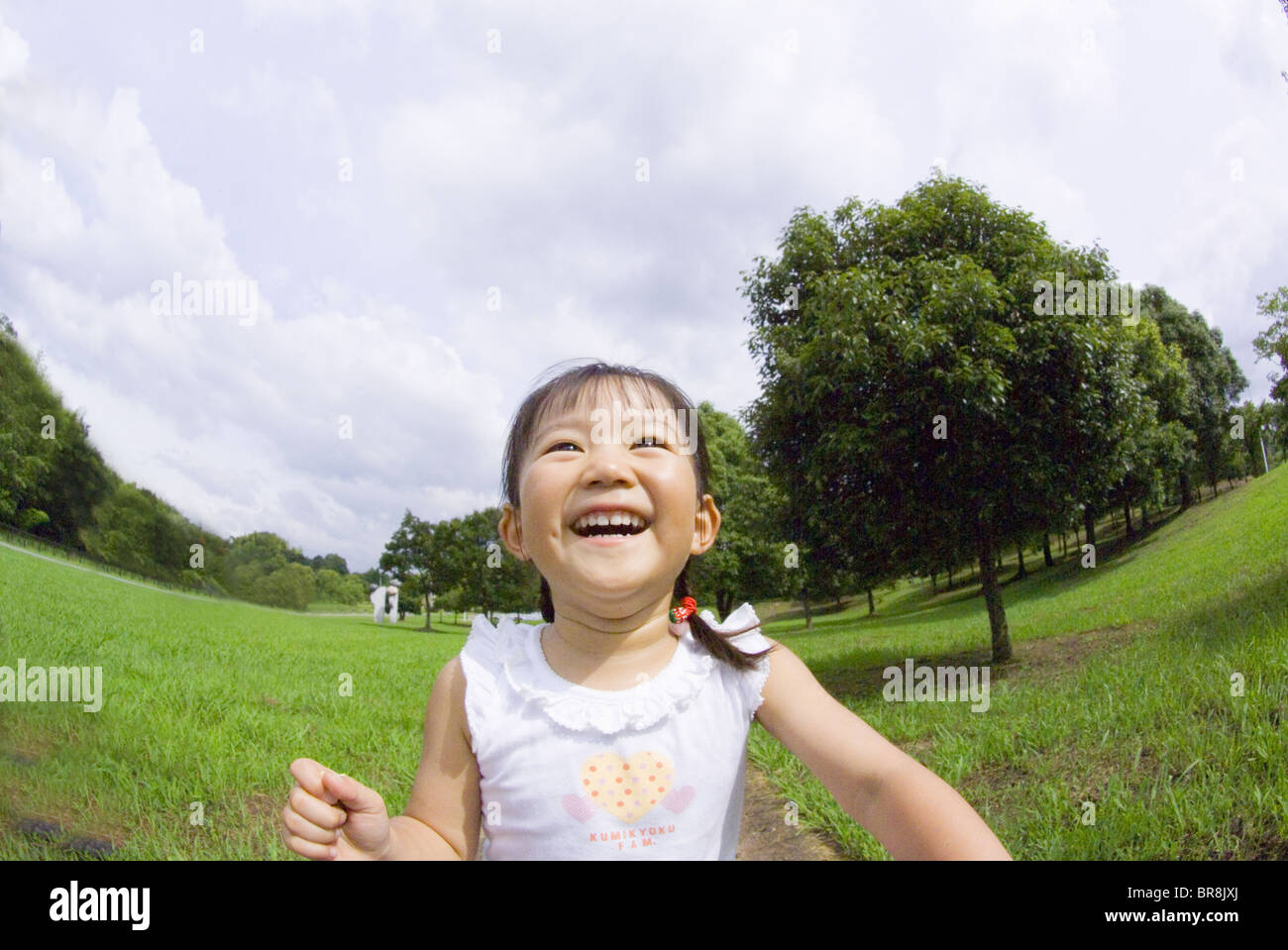 Girl riding a bicycle, Fish-Eye Lens Stock Photo - Alamy