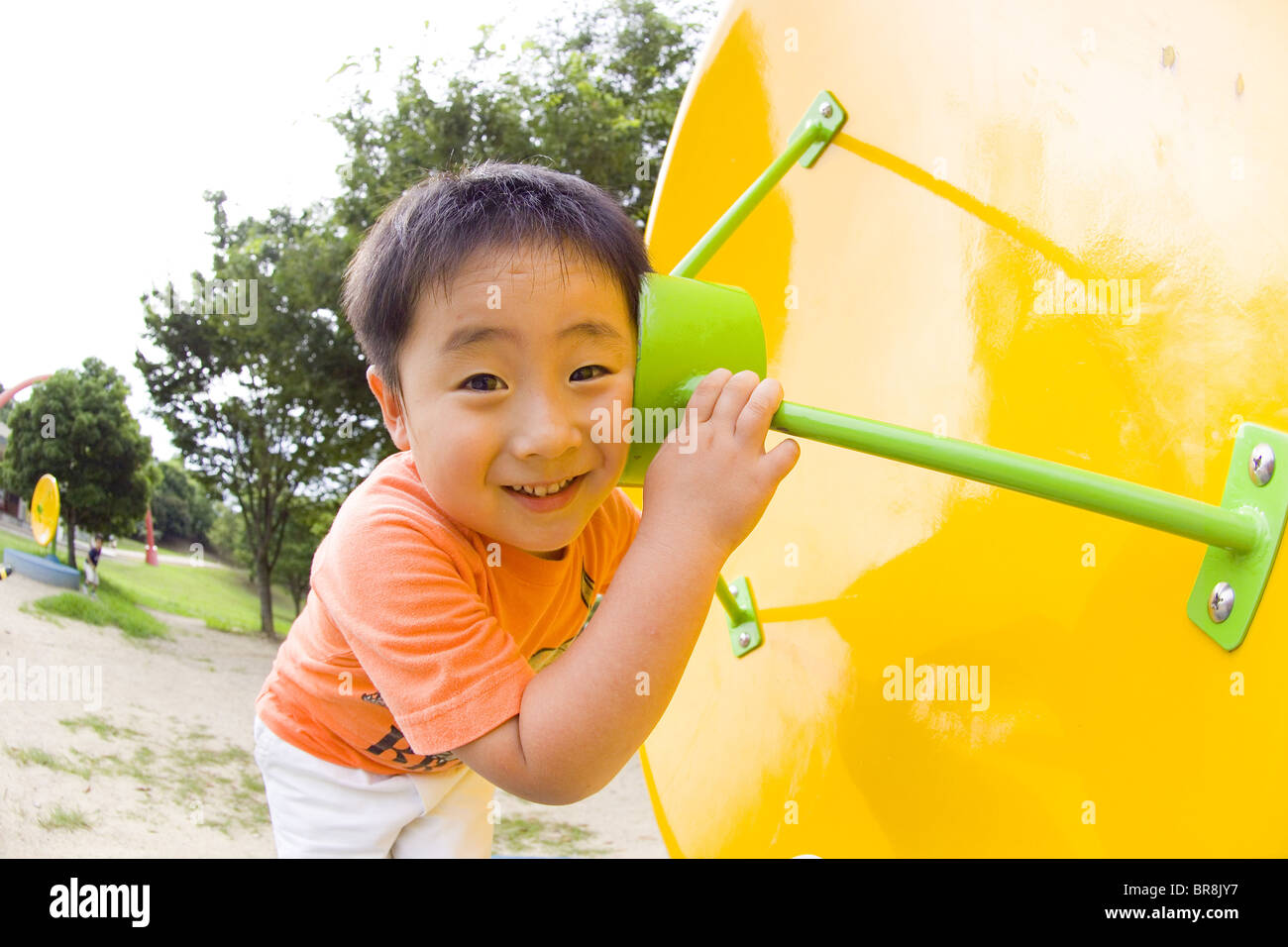 Boy at a playground Stock Photo - Alamy