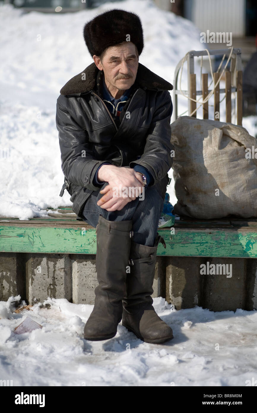 A local man in the town center during the winter in Baikalsk Siberia ...