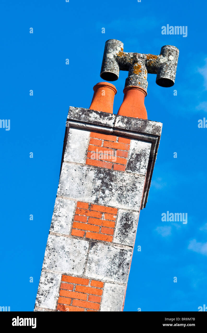 Old brick and stone chimney stack with H-shaped draft improver - France ...