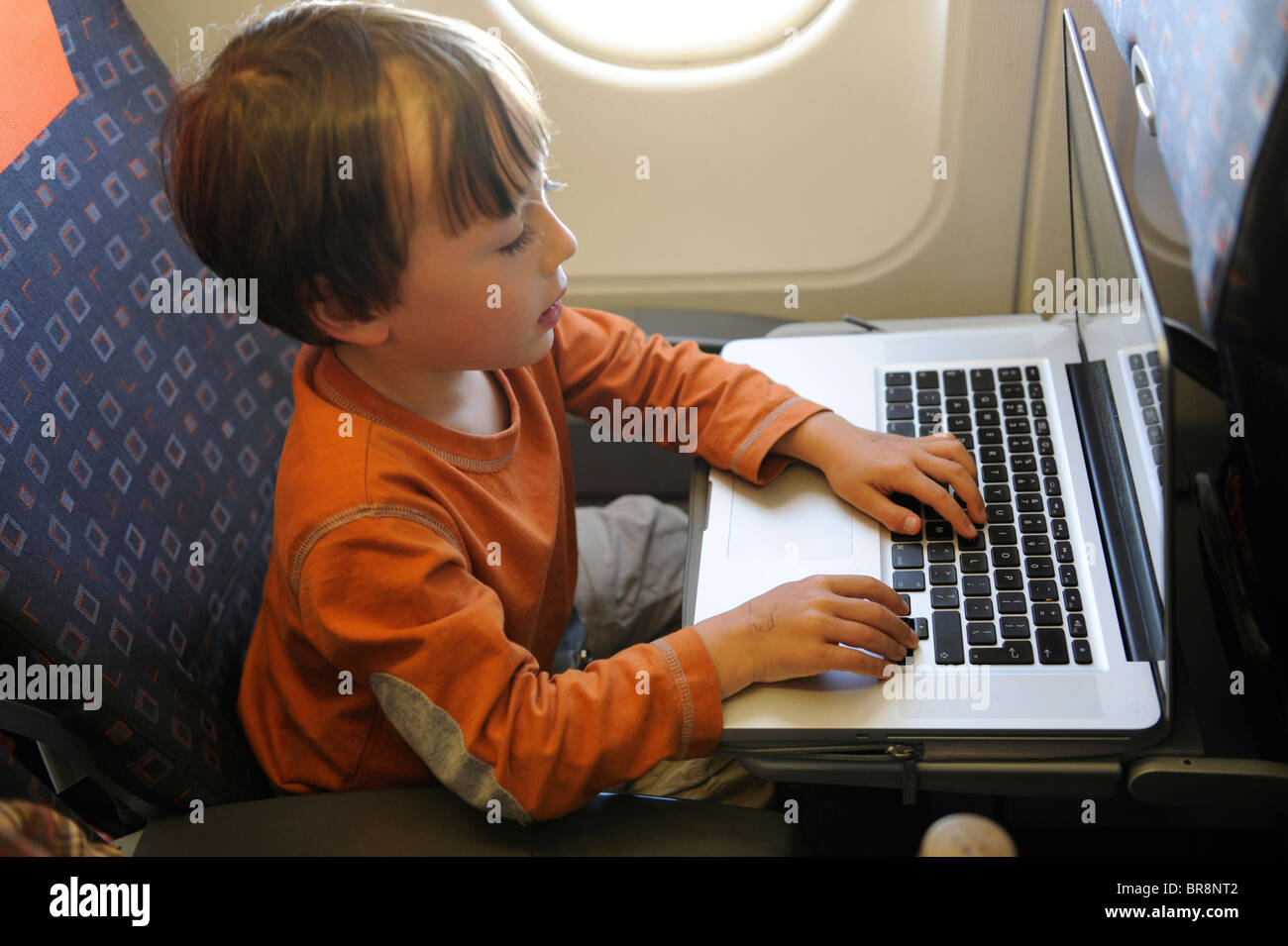 Young boy using apple laptop hi-res stock photography and images - Alamy