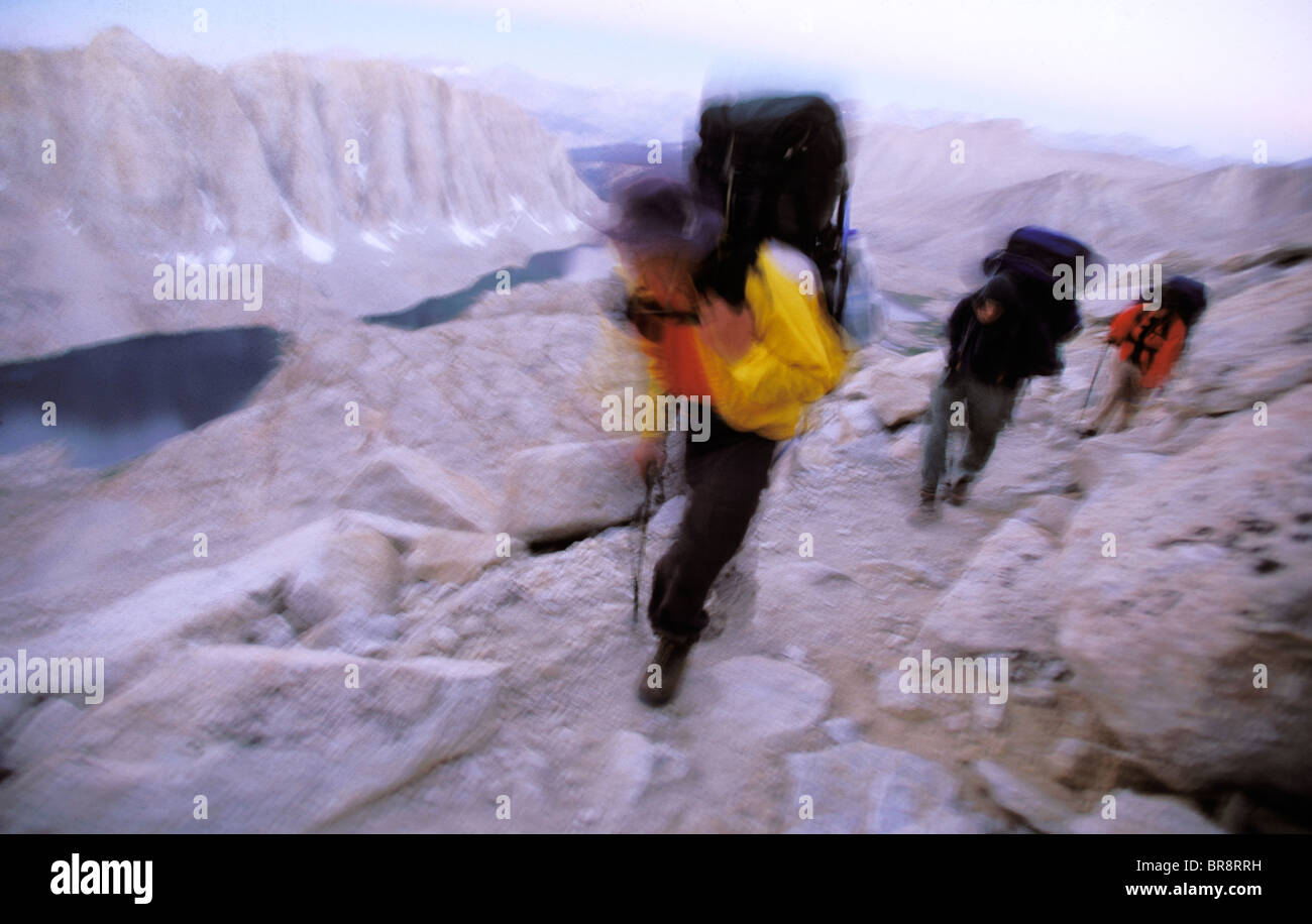 People backpacking above treeline and a mountain lake (Motion Blur ...