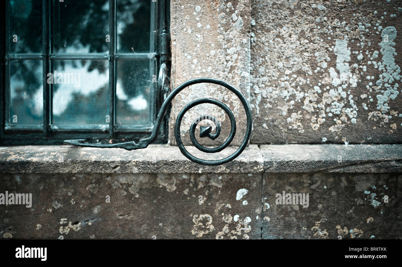 Ornate wrought iron window latch, England Stock Photo - Alamy