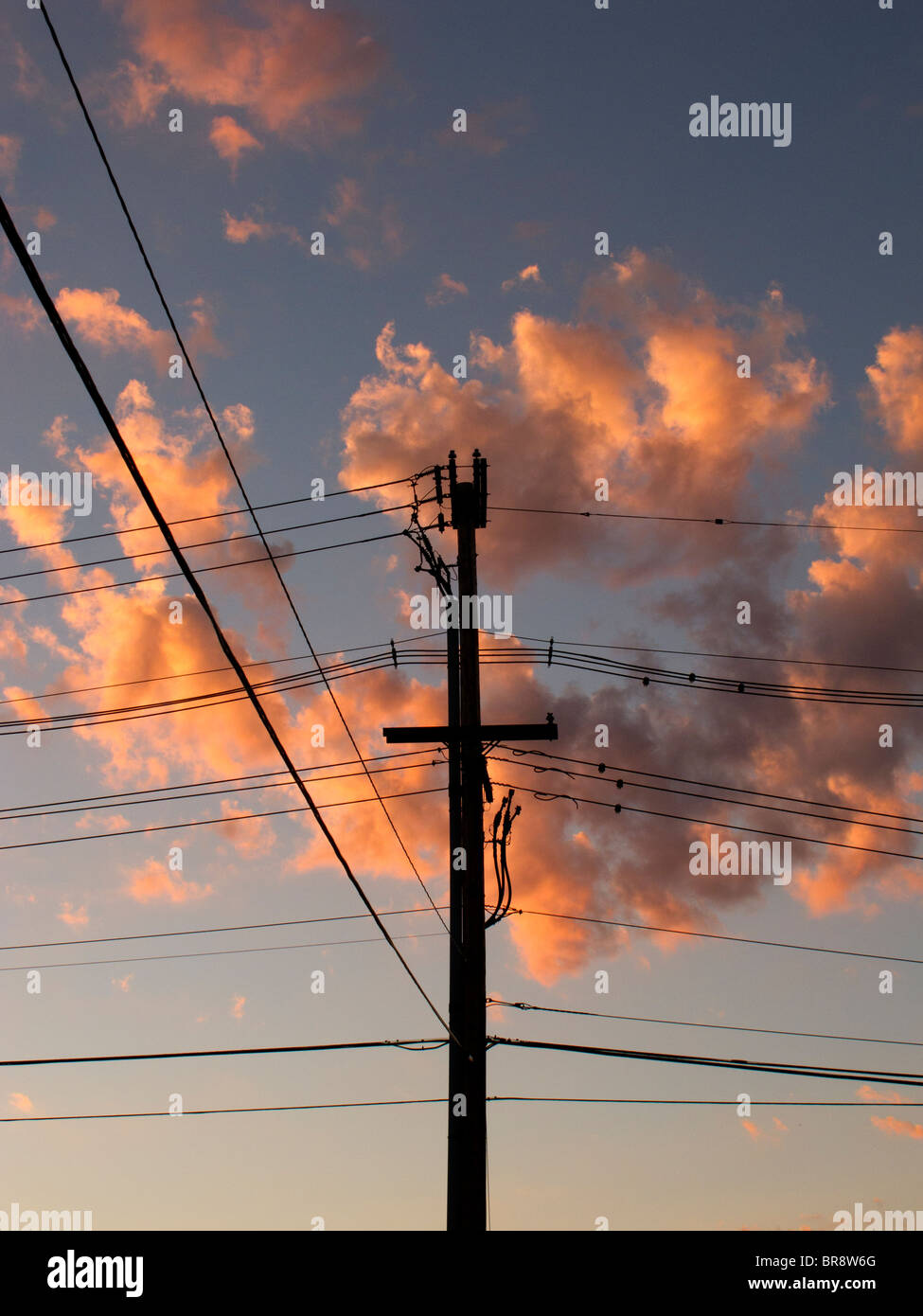 Utility pole and sunset clouds Stock Photo - Alamy