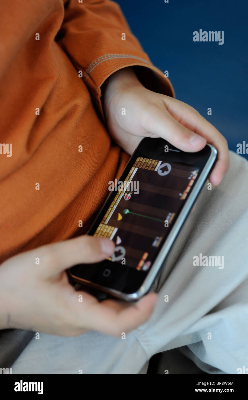 child playing on an iphone mobile phone application Stock Photo - Alamy