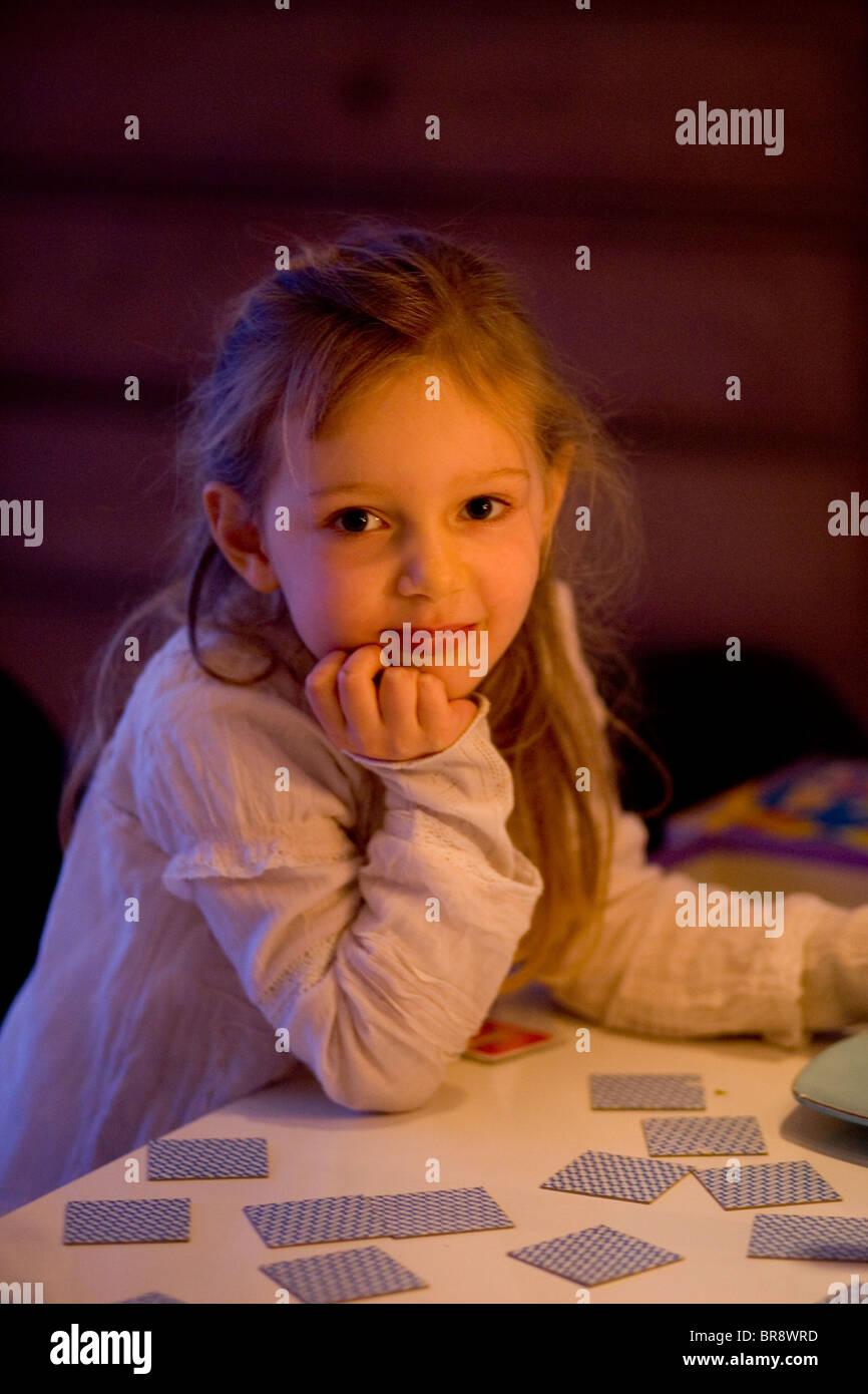 A young girl poses for a picture at a dining table in Copenhagen ...