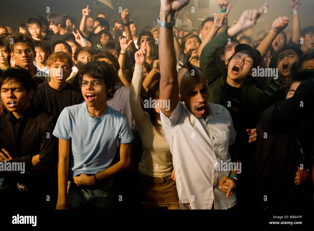 Fans at a concert in Singapore Stock Photo - Alamy