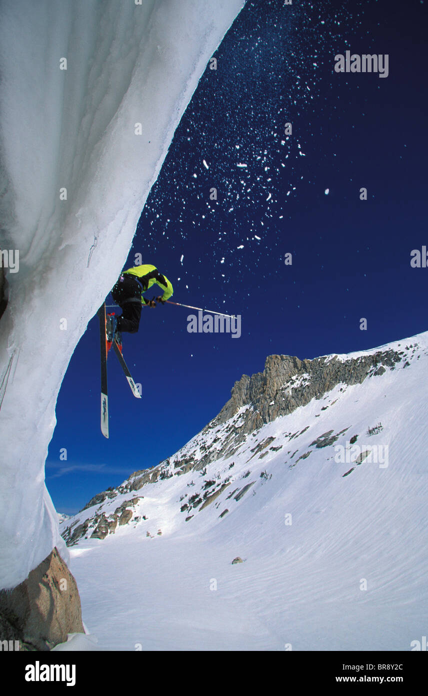 Backcountry skier jumping off of a cliff (Low Angle Perspective Stock ...
