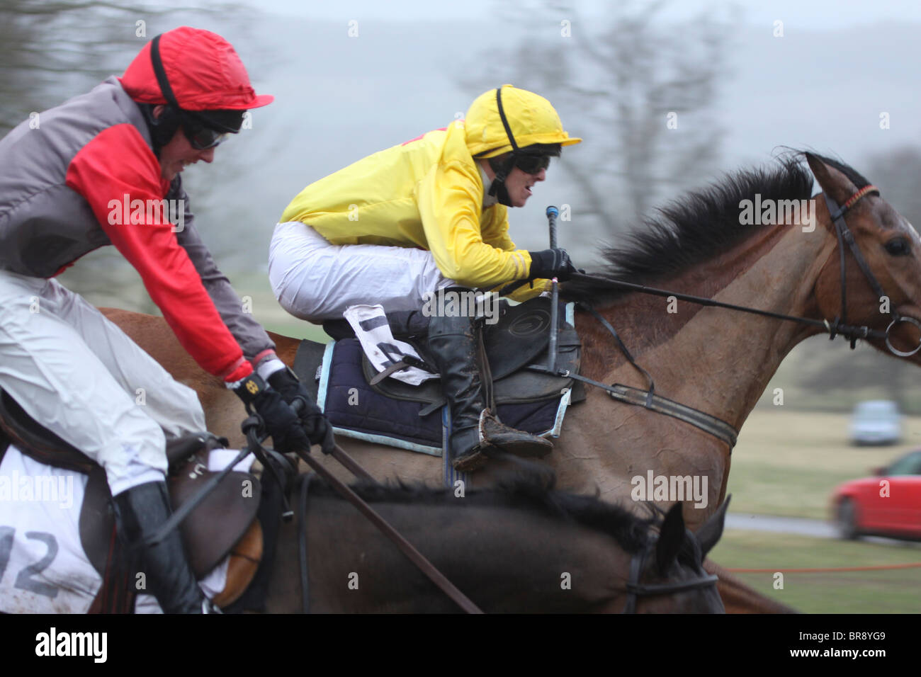Horsesjumping a fence during a point to point race Stock Photo - Alamy