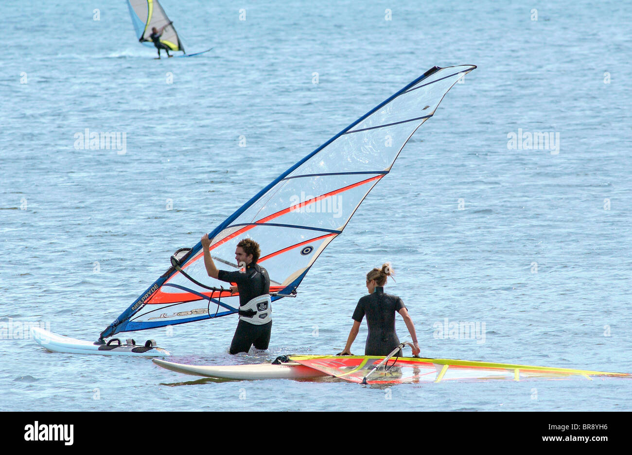 A couple windsurfing Stock Photo - Alamy