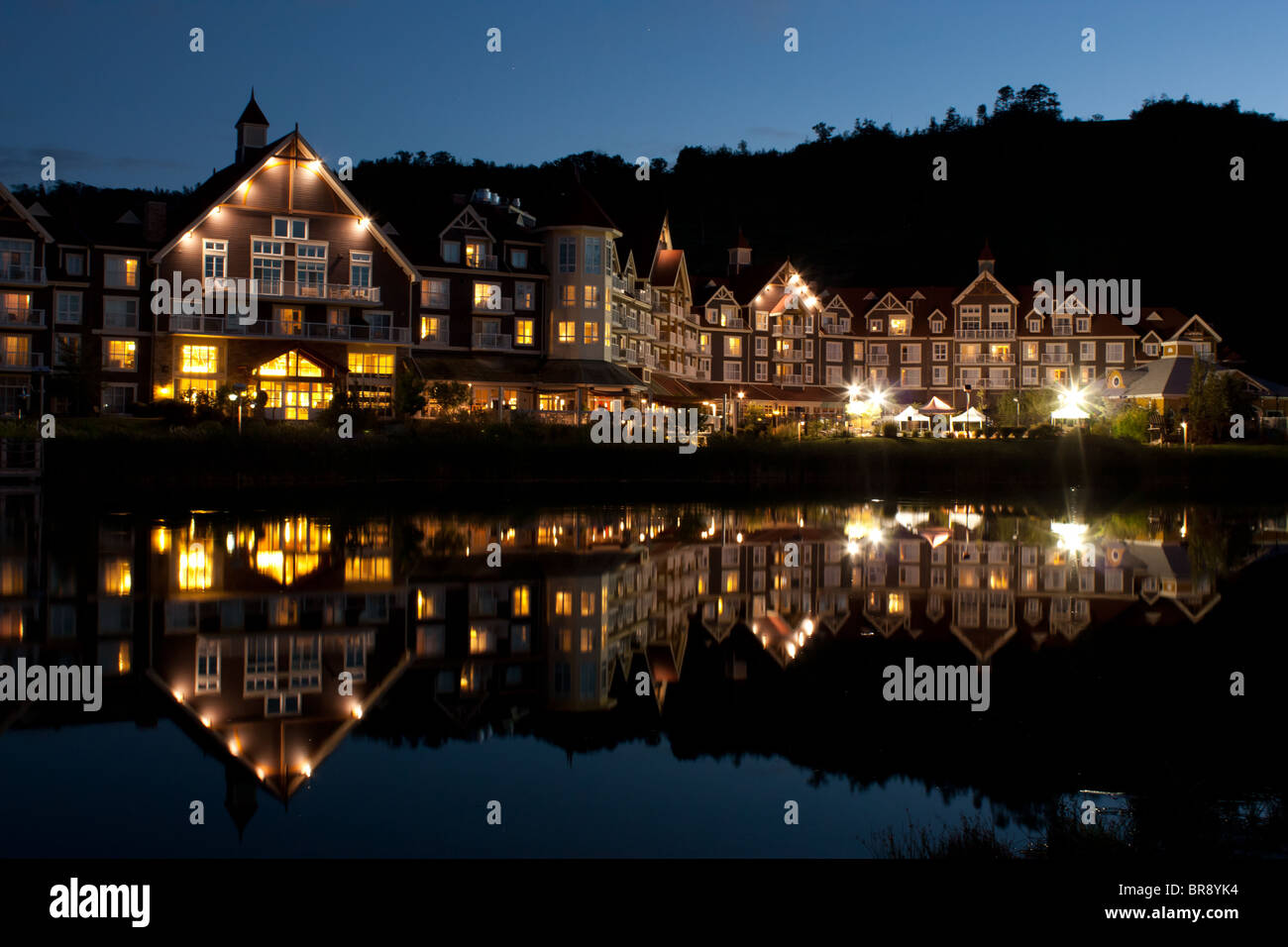 cottage cottages night water reflection blue sky Stock Photo - Alamy