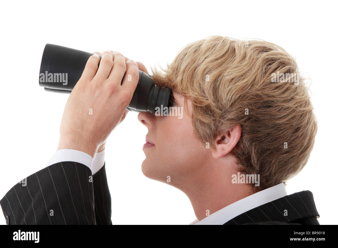 Business Vision concept - young man with binoculars isolated on white ...